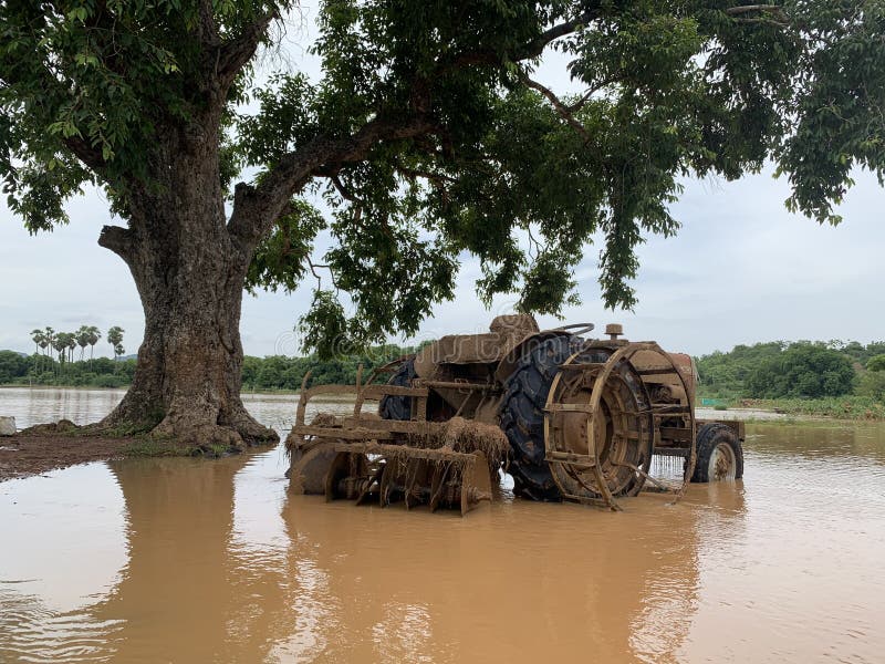 Tractor in the Mud Under Green Tree Stock Image - Image of travel ...