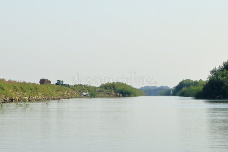 Tractor Near a Small River Channel in the Danube Delta Stock Image ...