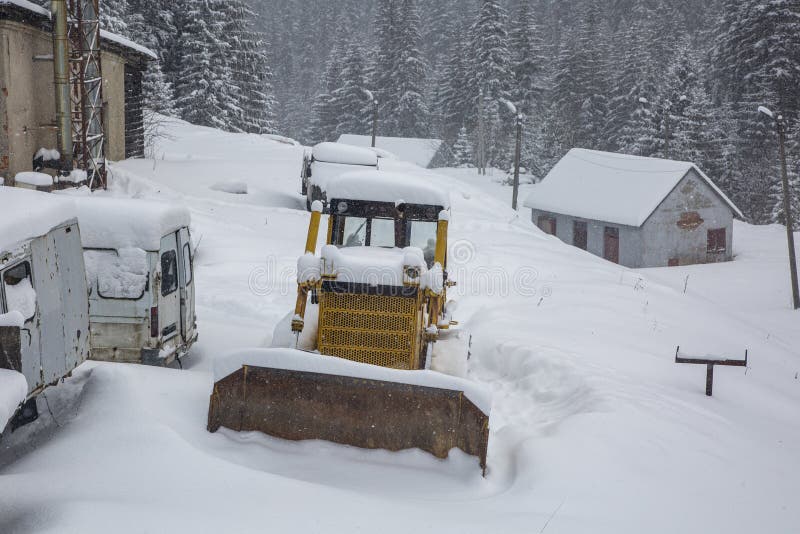 The Tractor and Old Vehicles is Covered with a Thick Layer of Snow ...