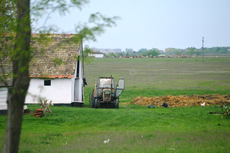 Tractor Parked in Front of the Garage Stock Image - Image of parked ...