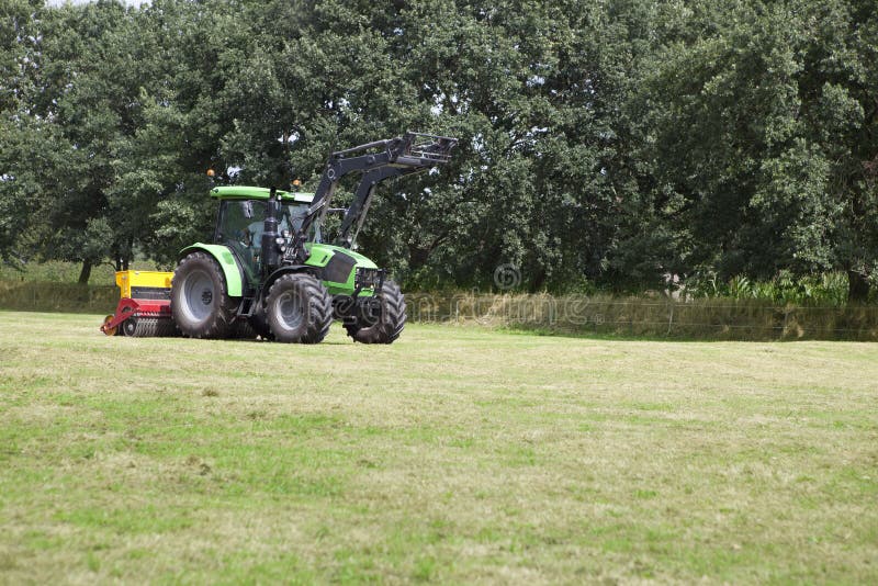 Tractor on pasture stock image. Image of equipment, cultivate - 124551685