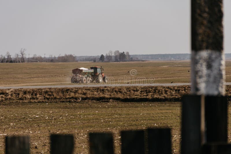 Tractor Performing Agricultural Work in the Field.. Stock Photo - Image ...