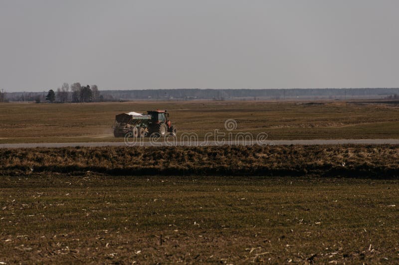 Tractor Performing Agricultural Work in the Field Stock Photo - Image ...