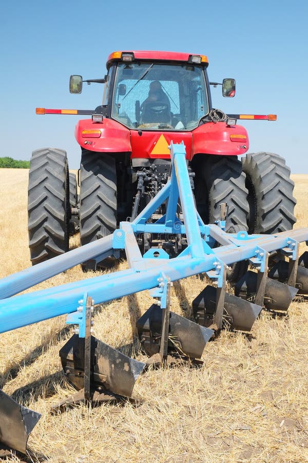 Tractor with a plow stock image. Image of automation - 43347007