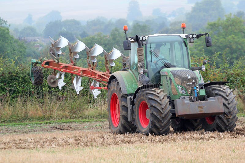 Tractor and Plow or Plough. Editorial Photography - Image of tractor ...