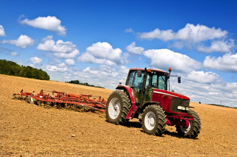 Tractor in plowed field stock image. Image of plough - 14765927