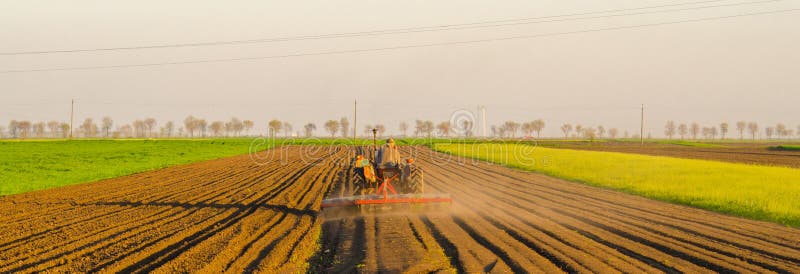Tractor Plowing Agricultural Field on Sunny Summer Day Stock Photo ...