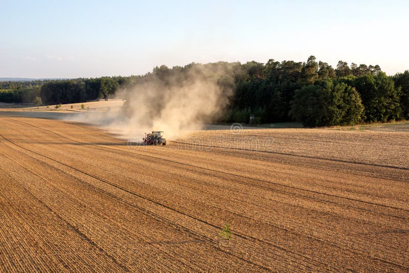 Tractor Plowing a Brown Dusty Field Stock Image - Image of nature ...