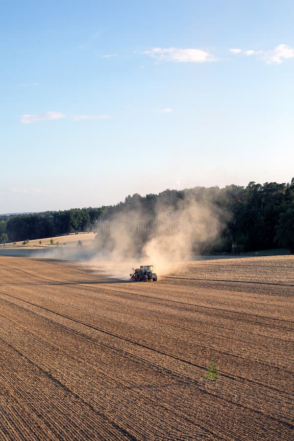 Tractor Plowing a Brown Dusty Field Stock Photo - Image of nature ...
