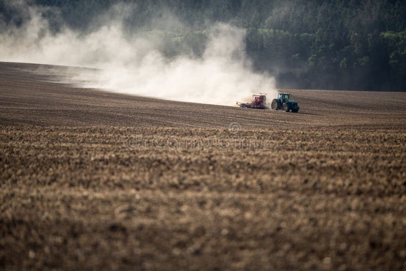 Tractor Plowing a Farm Field Stock Photo - Image of drought ...