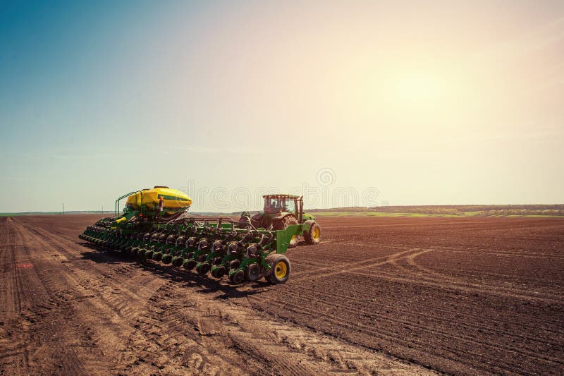 Tractor Plowing Farm Field in Preparation for Spring Planting ...