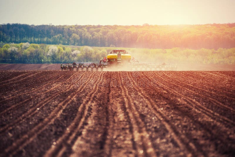 Tractor Plowing Farm Field in Preparation for Spring Planting Stock ...