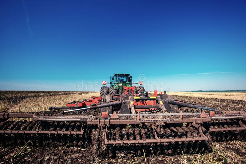 Tractor Plowing Farm Field in Preparation for Spring Planting Stock ...