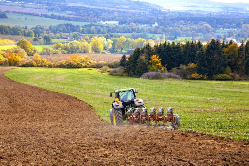 Old Red Tractor Plowing in Autumn, Farmer Plowing Stubble Field in ...
