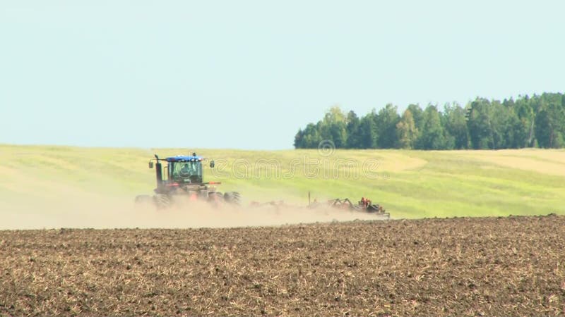 Tractor Plowing a Field on the Forest Background Stock Footage - Video ...