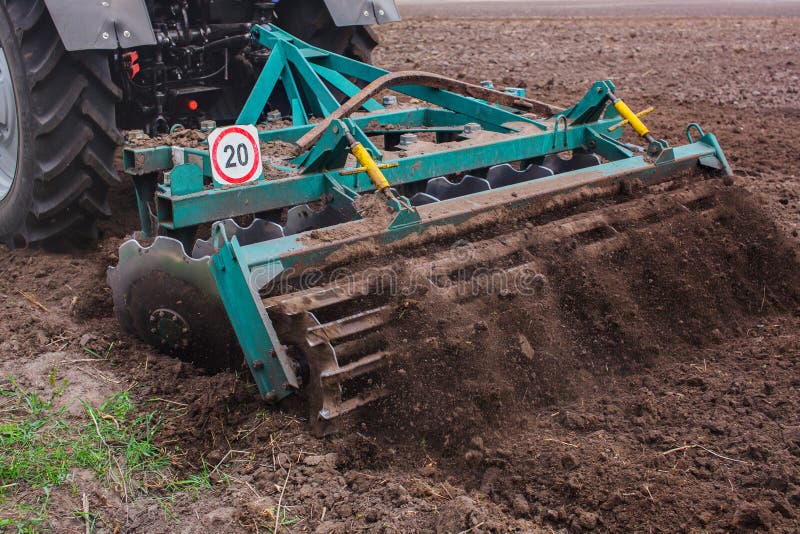 Tractor plowing a field. stock image. Image of drag, modern - 77038805