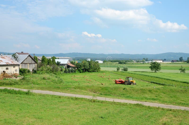 Tractor Plowing the Field in Spring,Poland,Eastern Europe Stock Image ...