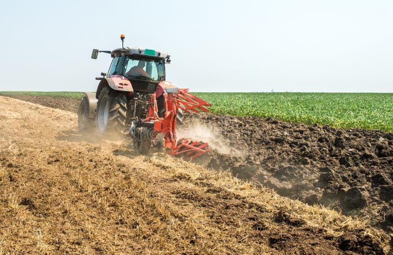 Tractor plowing field stock image. Image of season, countryside - 64391363