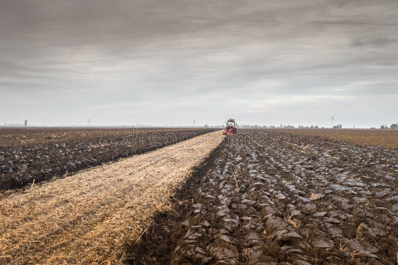 Tractor plowing field stock image. Image of rural, landscaped - 62941431