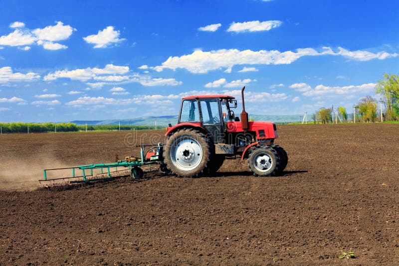Tractor Plowing the Fields in Early Spring. Stock Image - Image of ...