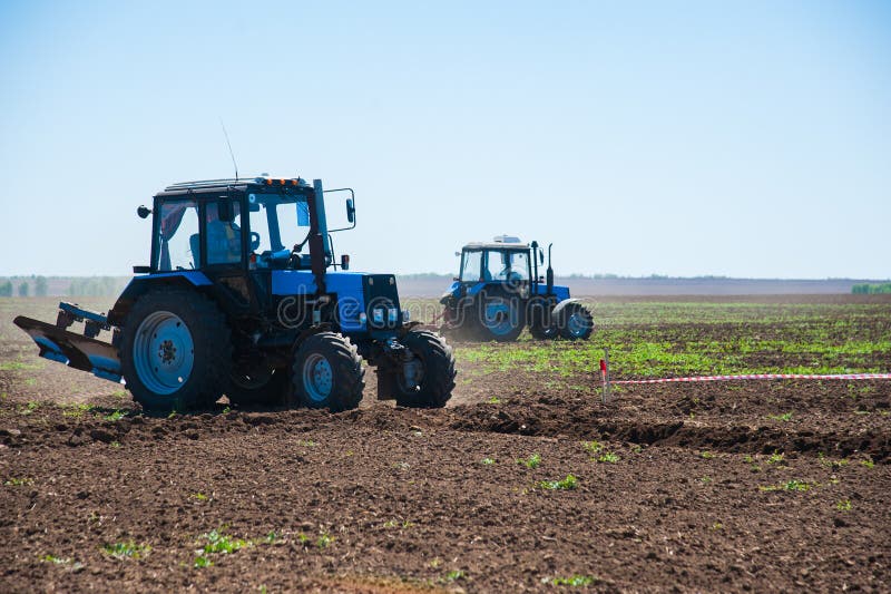 Agriculture with a tractor editorial photography. Image of machinery ...