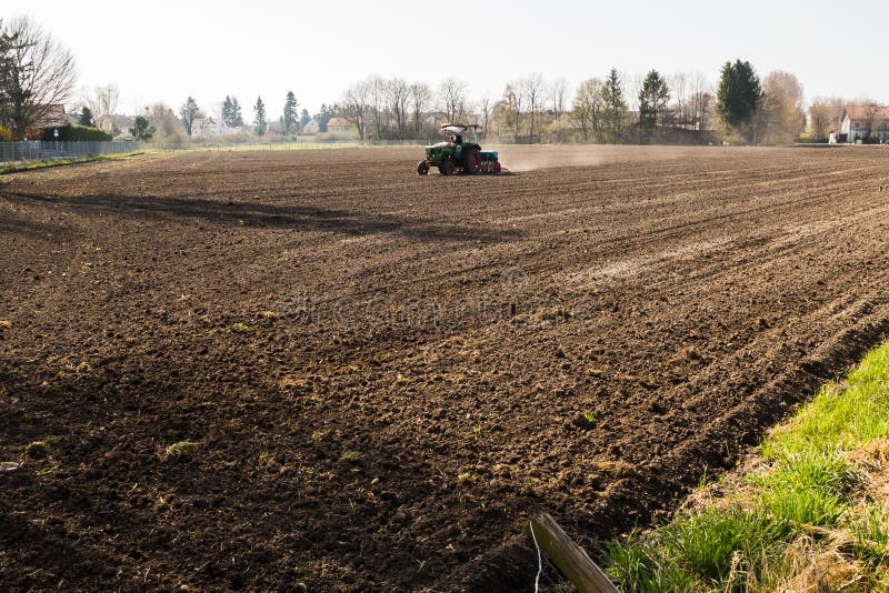 Tractor Plowing the Land for the Next Crop Stock Photo - Image of ...