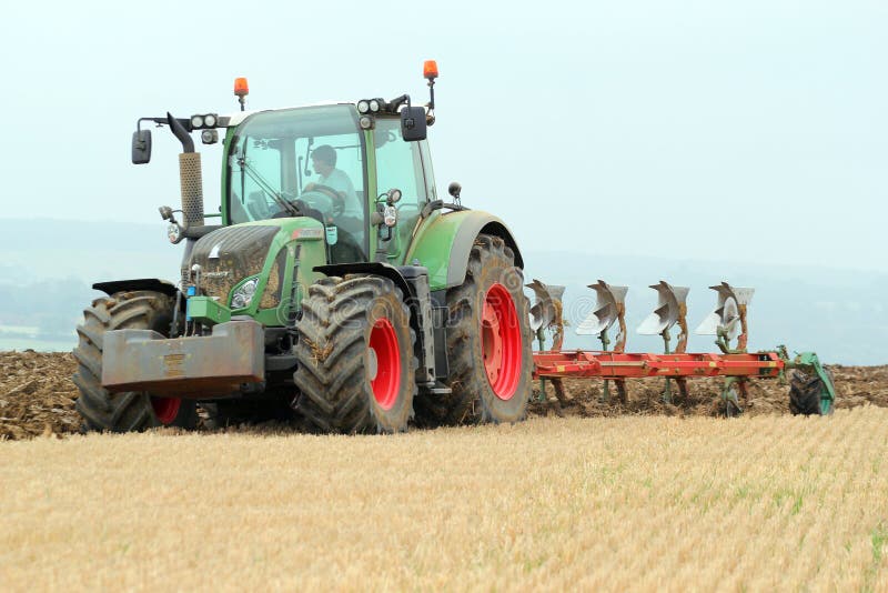 Tractor Plowing or Ploughing a Field. Editorial Stock Photo - Image of ...