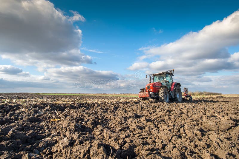 Tractor Plowing stock photo. Image of equipment, field - 48657358