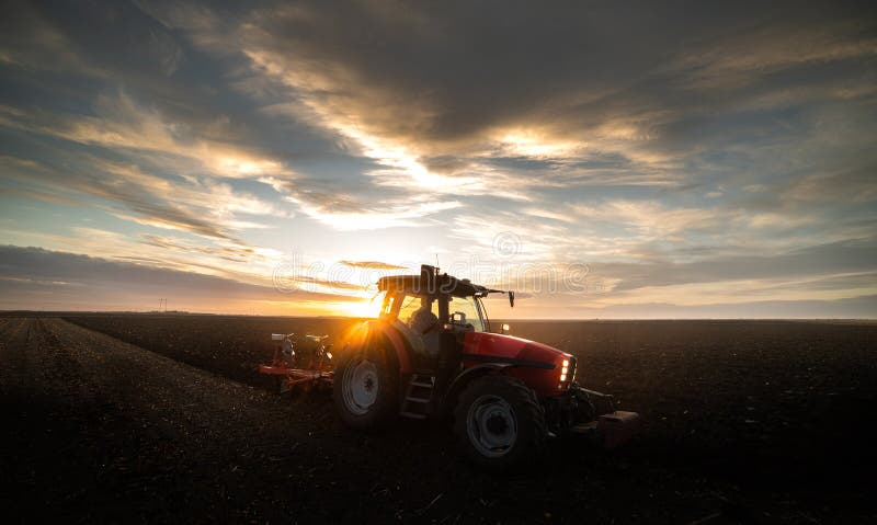 Tractor on the Field during Sunset Stock Photo - Image of industry ...