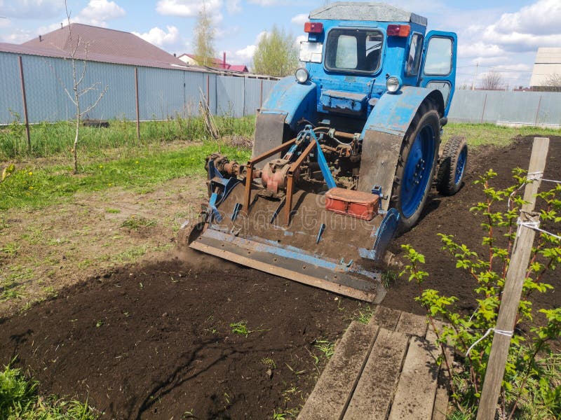 The Tractor Plows the Soil on the Field Stock Image - Image of rural ...