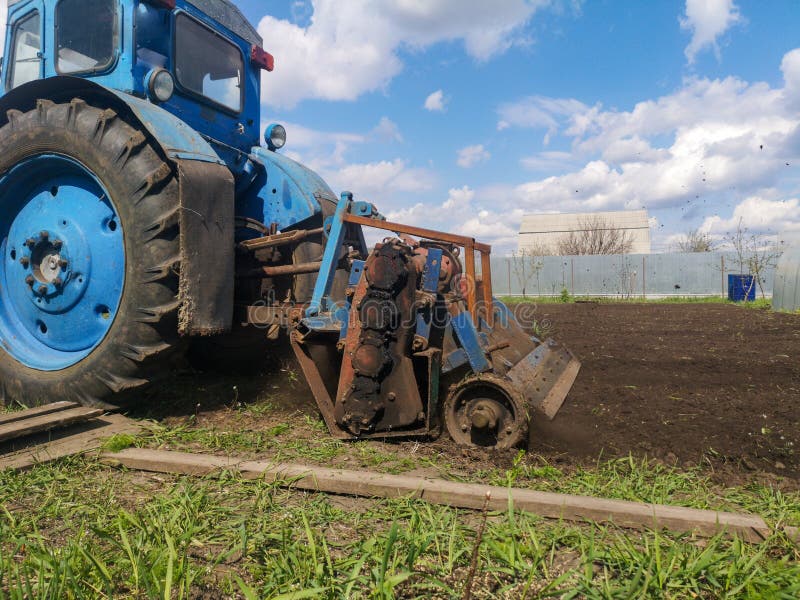 The Tractor Plows the Soil on the Field Stock Photo - Image of ...