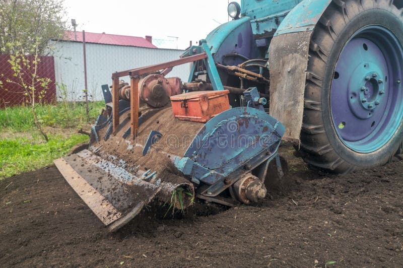 The Tractor Plows the Soil on the Field Stock Photo - Image of work ...