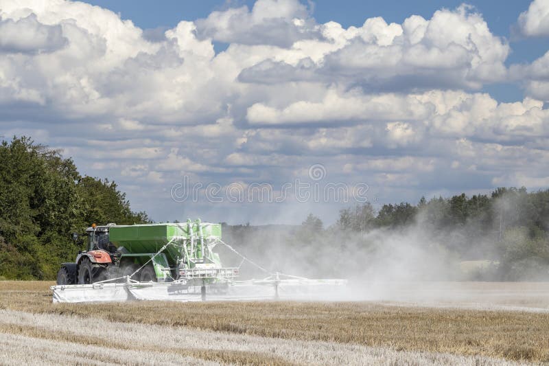 A Tractor Preparing the Field Stock Image - Image of preparing, clouds ...