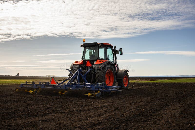 Tractor is Preparing the Land at Dusk Stock Photo - Image of effect ...