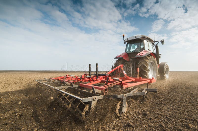 Tractor preparing land stock image. Image of working - 68659651