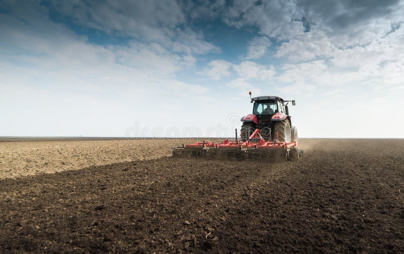 Tractor preparing land stock photo. Image of rural, landscaped - 68659794