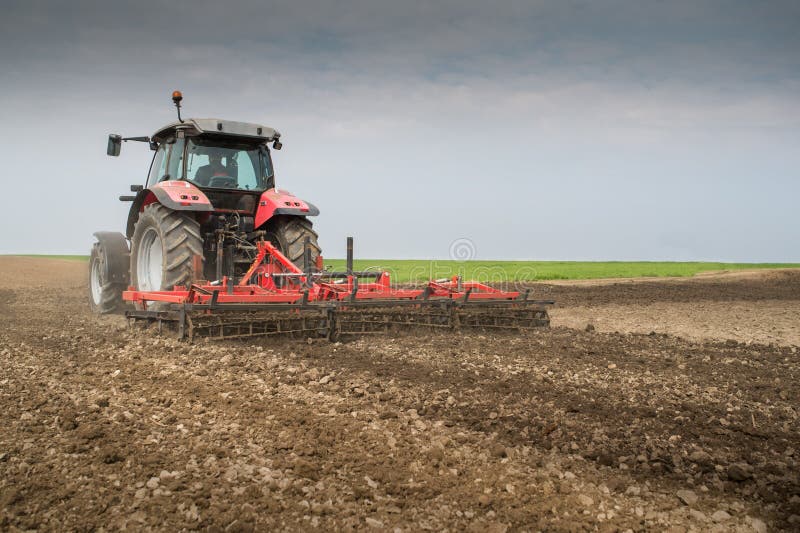 Tractor preparing land stock photo. Image of field, rural - 68659824