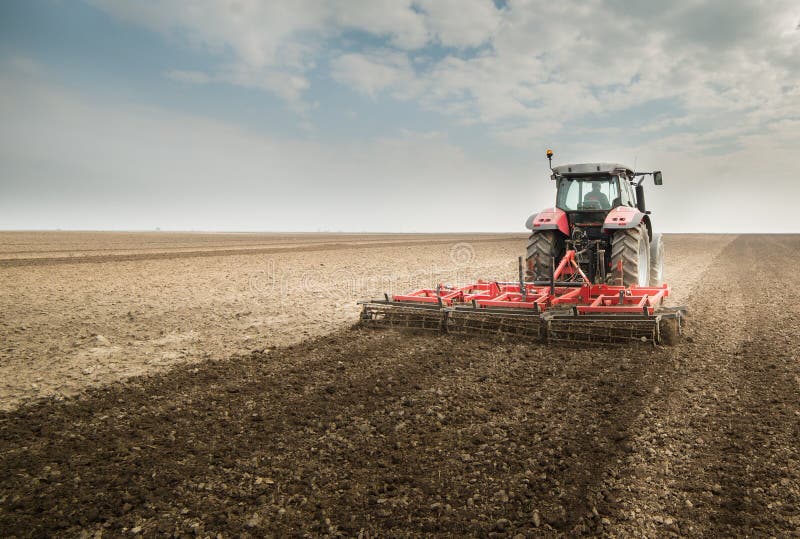 Tractor preparing land stock photo. Image of autumn, preparation - 68659826