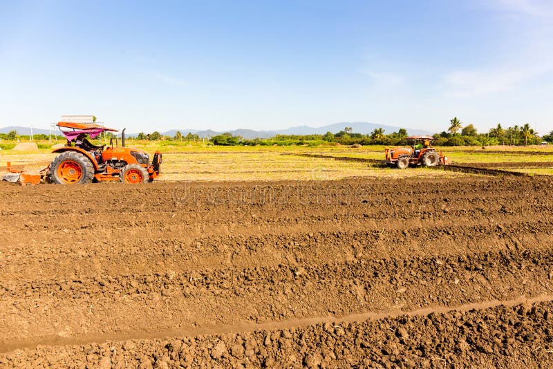 Tractor preparing land stock image. Image of finance - 127944775