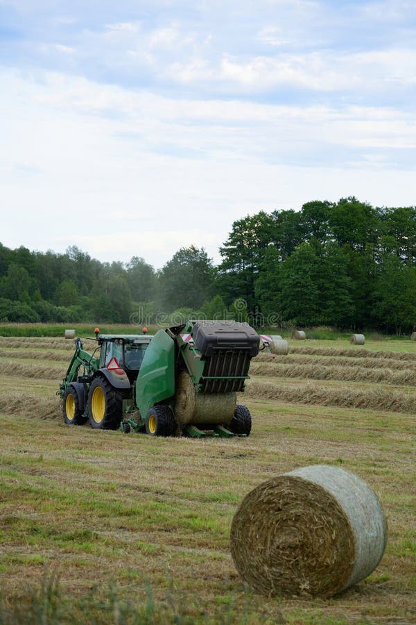 Tractor for the Production of Round Haystacks Stock Photo - Image of ...