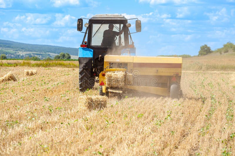 Tractor Pulling Baler To Make Fresh Hay Bales Editorial Photo - Image ...