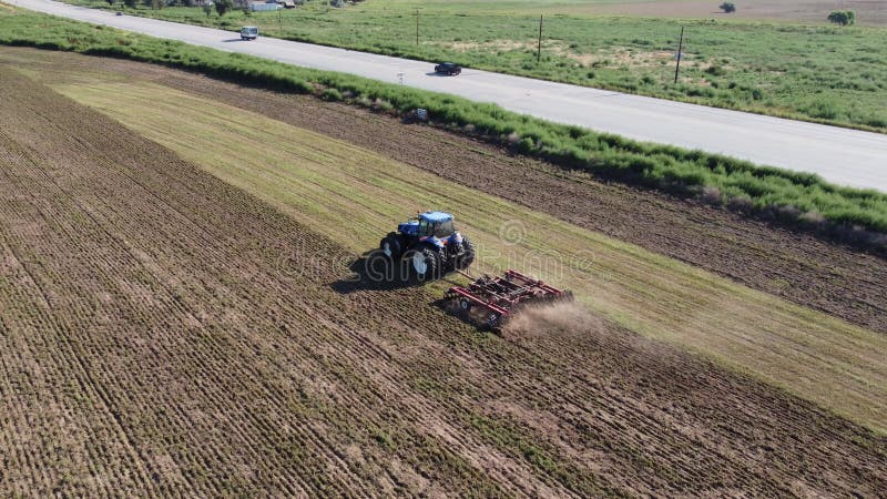 Tractor Tilling with Harrow Stock Video - Video of aerial, cultivating ...