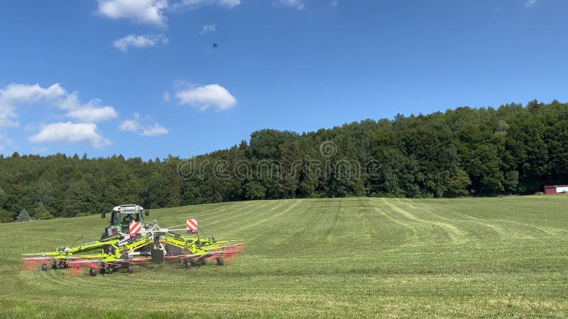 Tractor Raking Grass for Silage Harvesting Stock Footage - Video of ...
