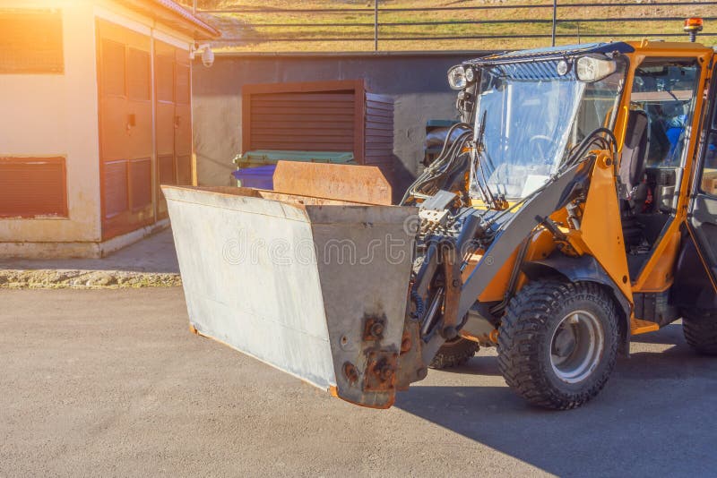 Tractor with Removable Bucket, for Garbage and Waste Stock Image ...