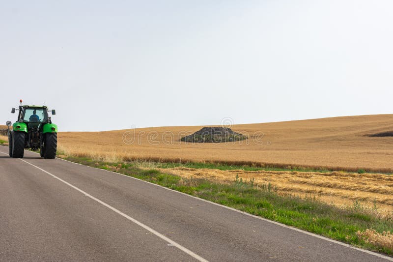 Tractor on the Road in the Middle of Sown Fields Stock Image - Image of ...