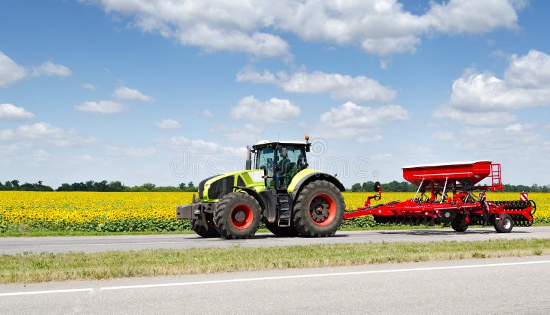 Tractor on the road stock photo. Image of farming, crop - 57787008