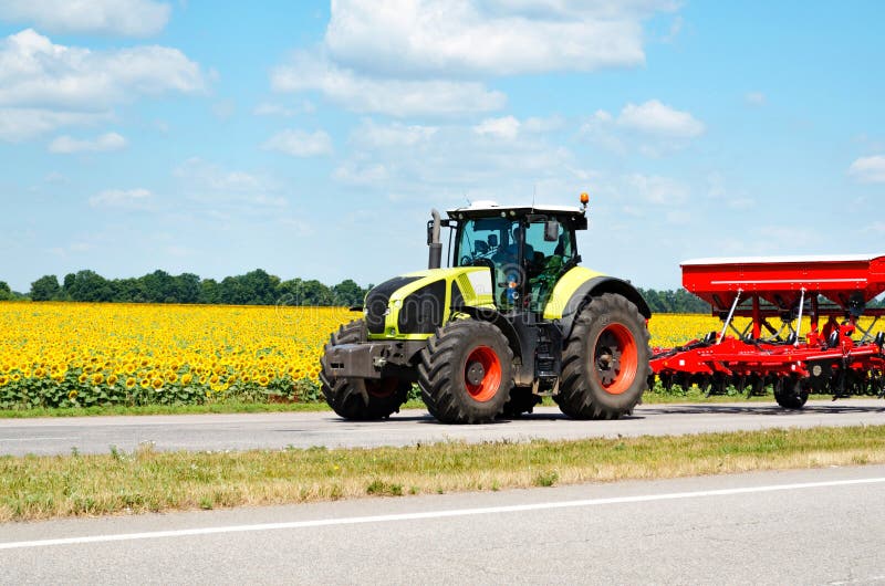 Tractor on the road stock photo. Image of agriculture - 58065204