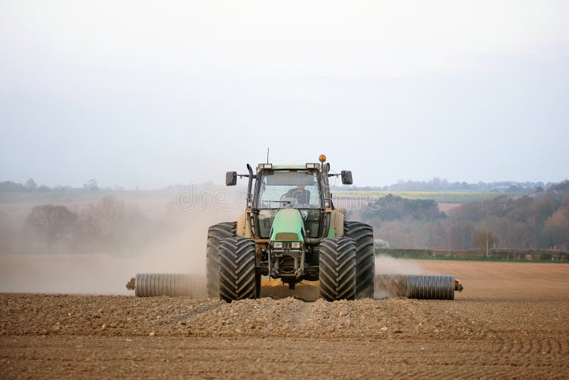 TRactor rolling the fields editorial image. Image of spring - 178593930