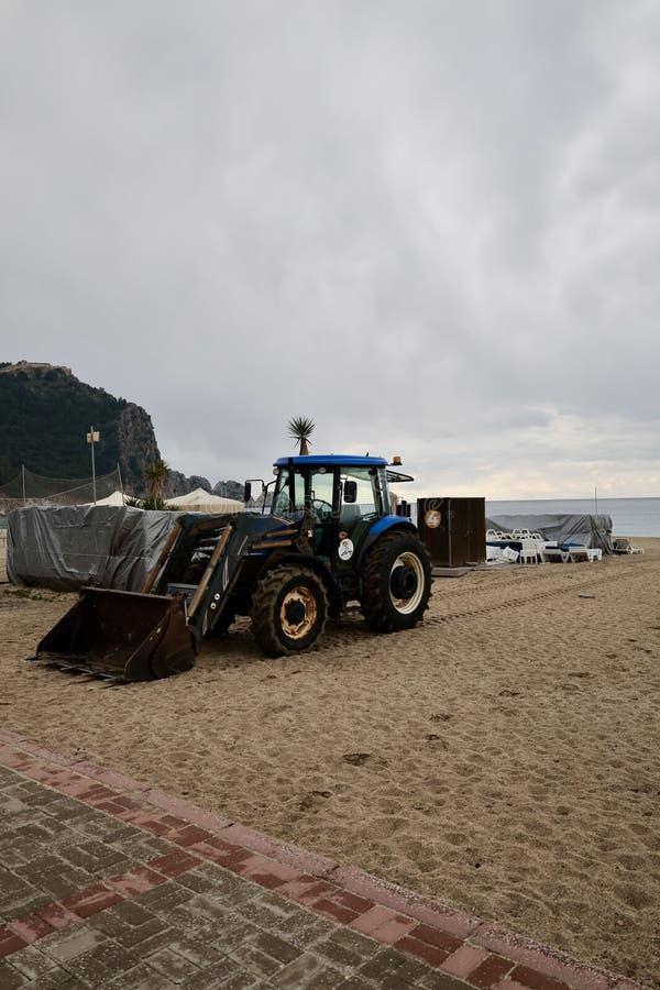 Tractor on the sea beach stock photo. Image of city - 361014354
