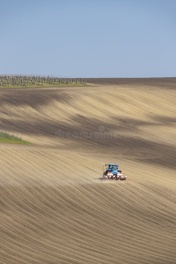 Tractor with Seed Drill in Early Spring Landscape Stock Image - Image ...